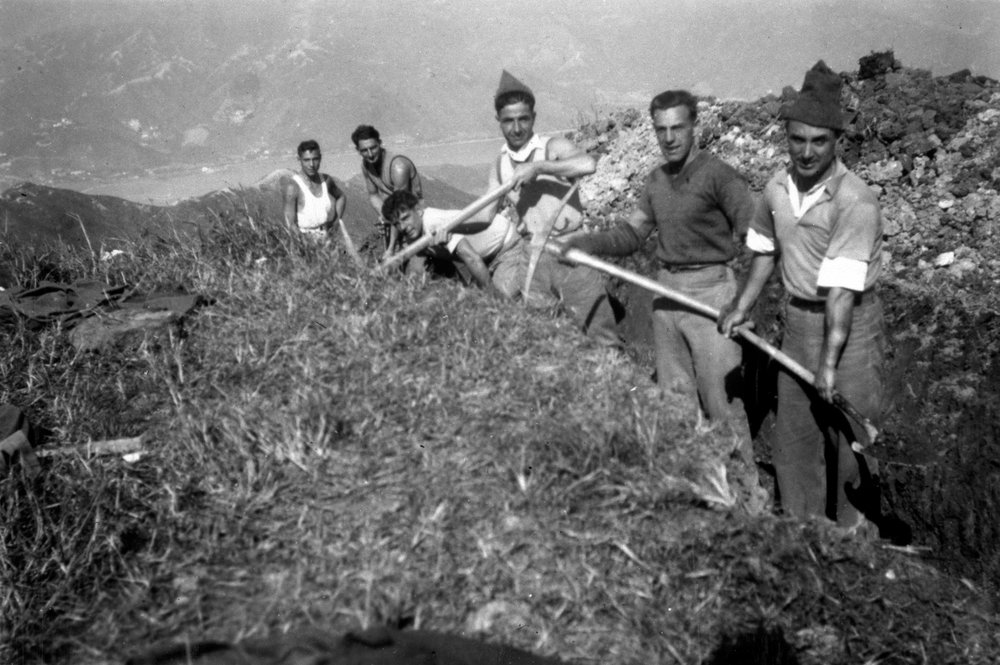 Men digging trenches by English Photographer