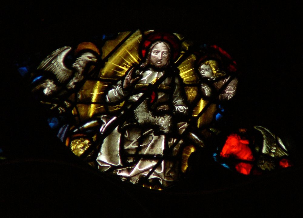 The west rose window depicting a scene from the Book of Revelation ...