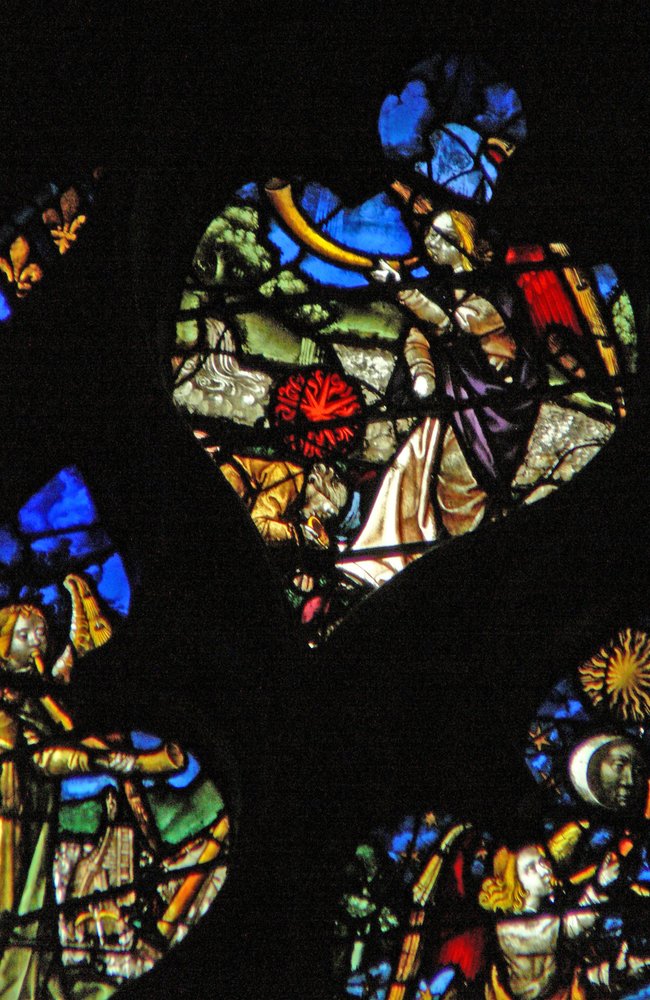 The west rose window depicting a scene from the Book of Revelation ...