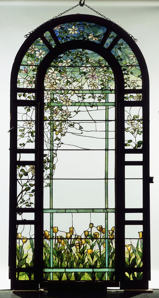 A leaded glass trellised window depicting clematis vines, early 20th ...