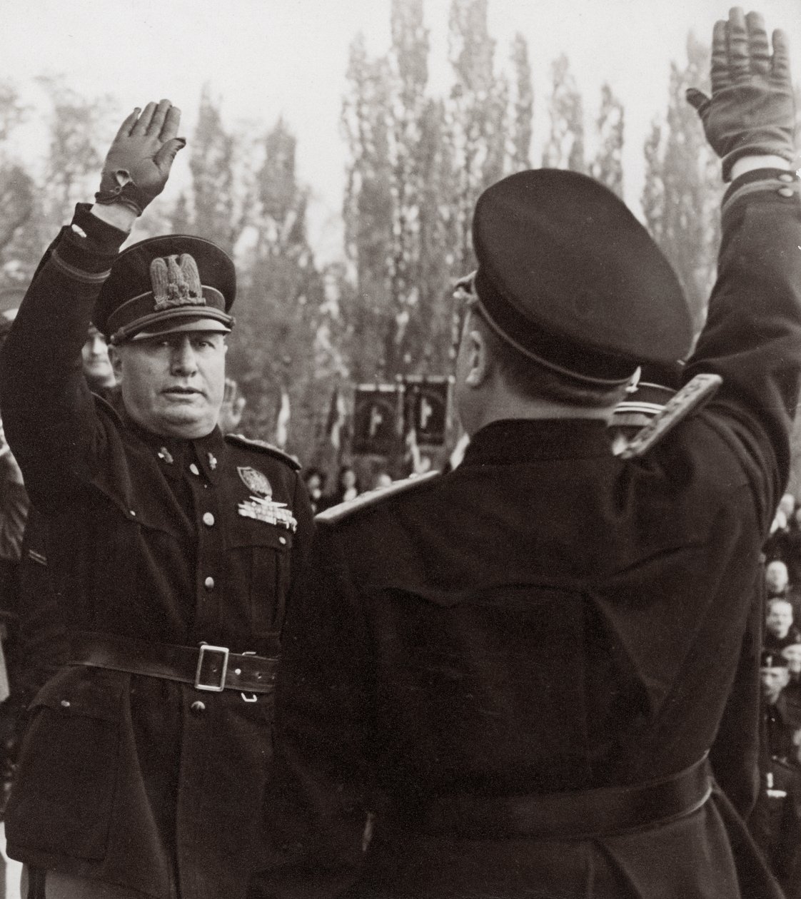 Benito Mussolini Honors a Fascist Official with a Salute