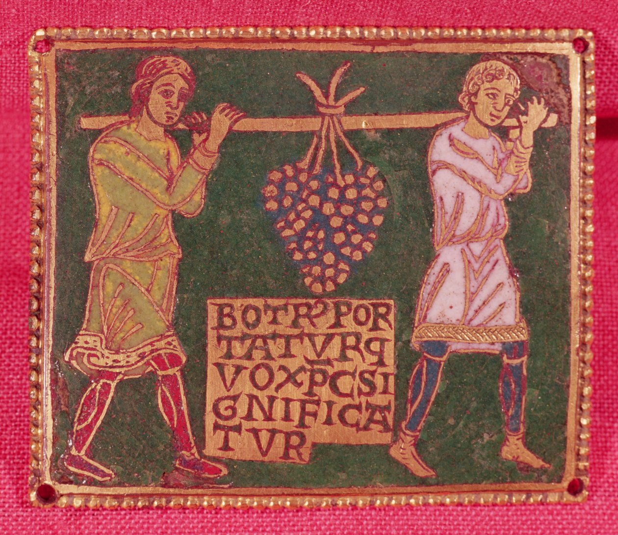 Plaque from a cross depicting two men carrying the grapes of the ...