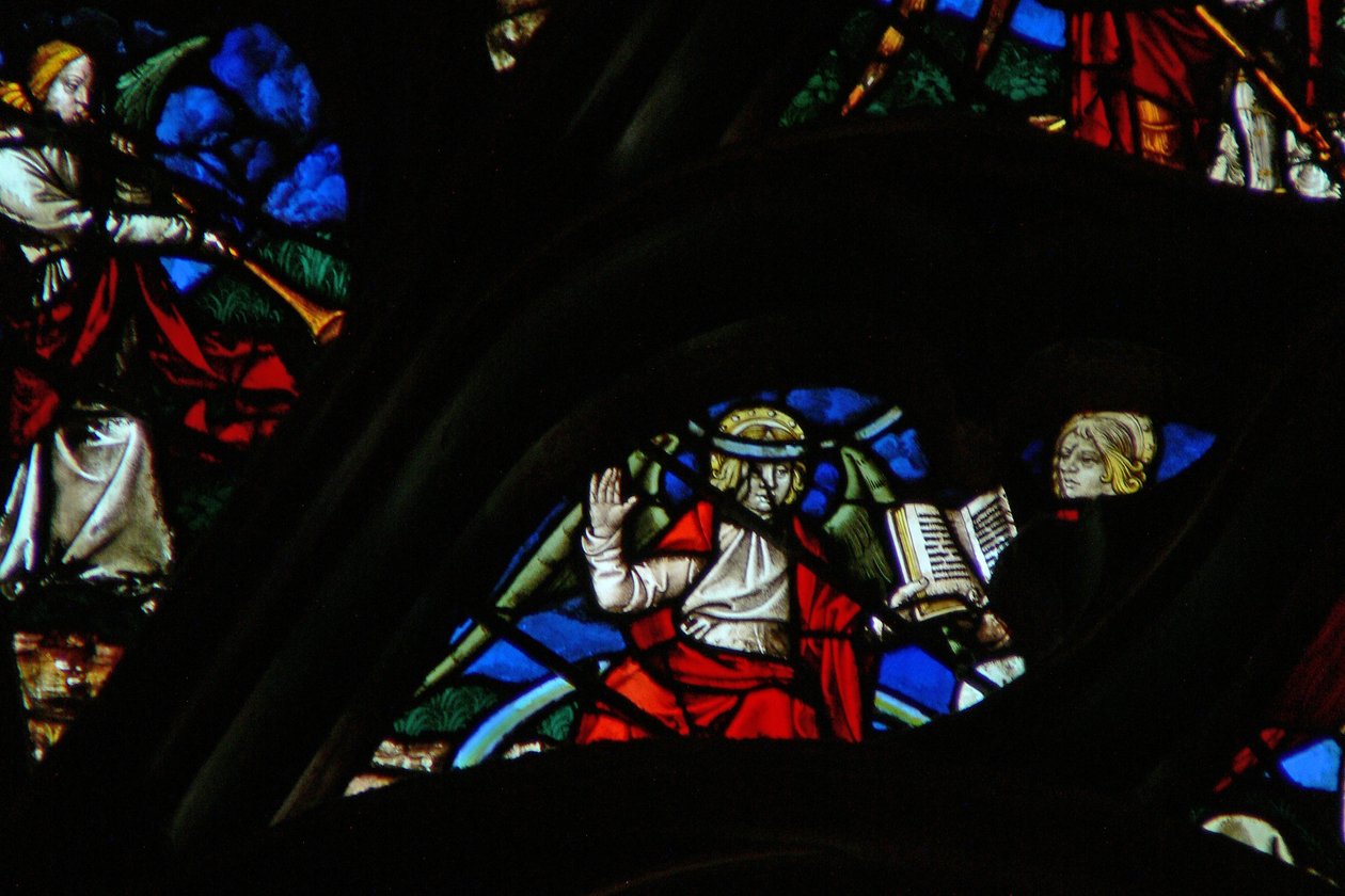 The west rose window depicting a scene from the Book of Revelation: An ...